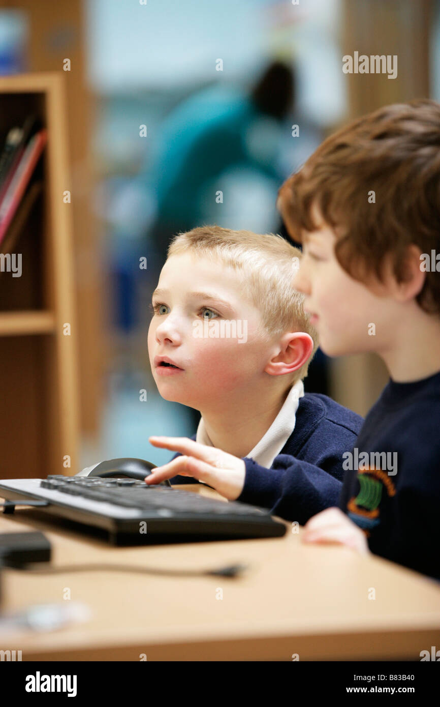 primary school pupils working on laptop computer Stock Photo - Alamy