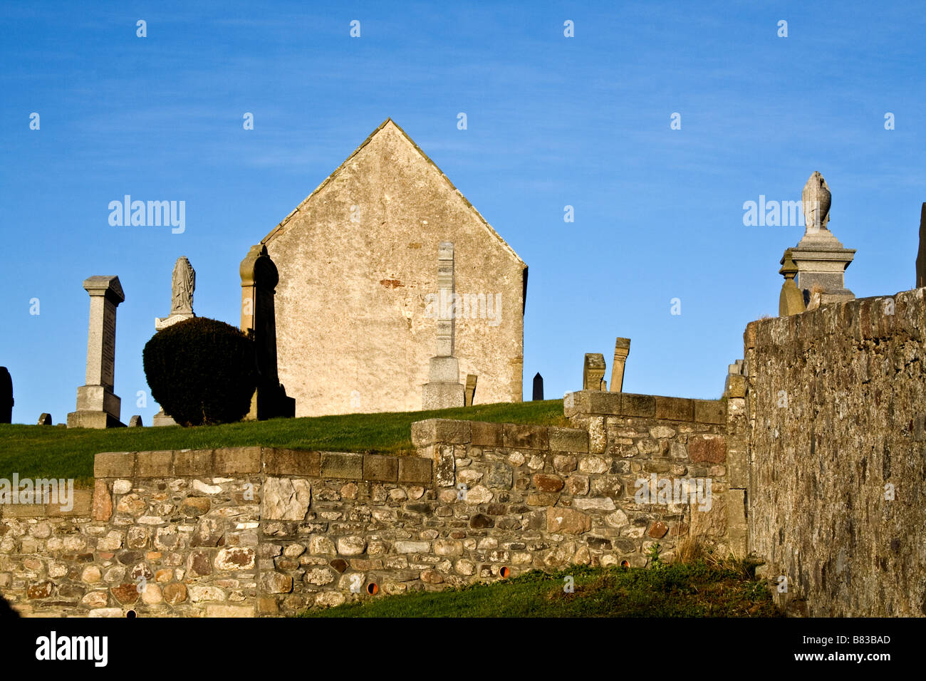 Stone wall surrounding a cemetery in Rathven, Scotland Stock Photo - Alamy