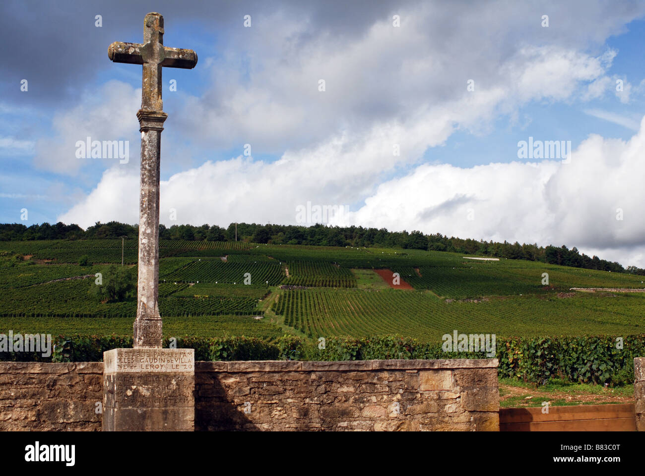 The cross at the foot of Romanée Conti vineyard, Vosne Romanée, Cote de ...