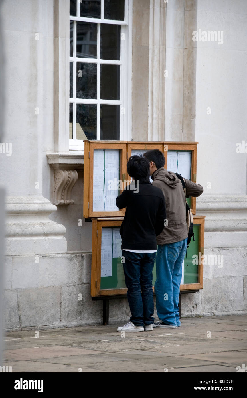 Students check results boards at Cambridge University Stock Photo - Alamy