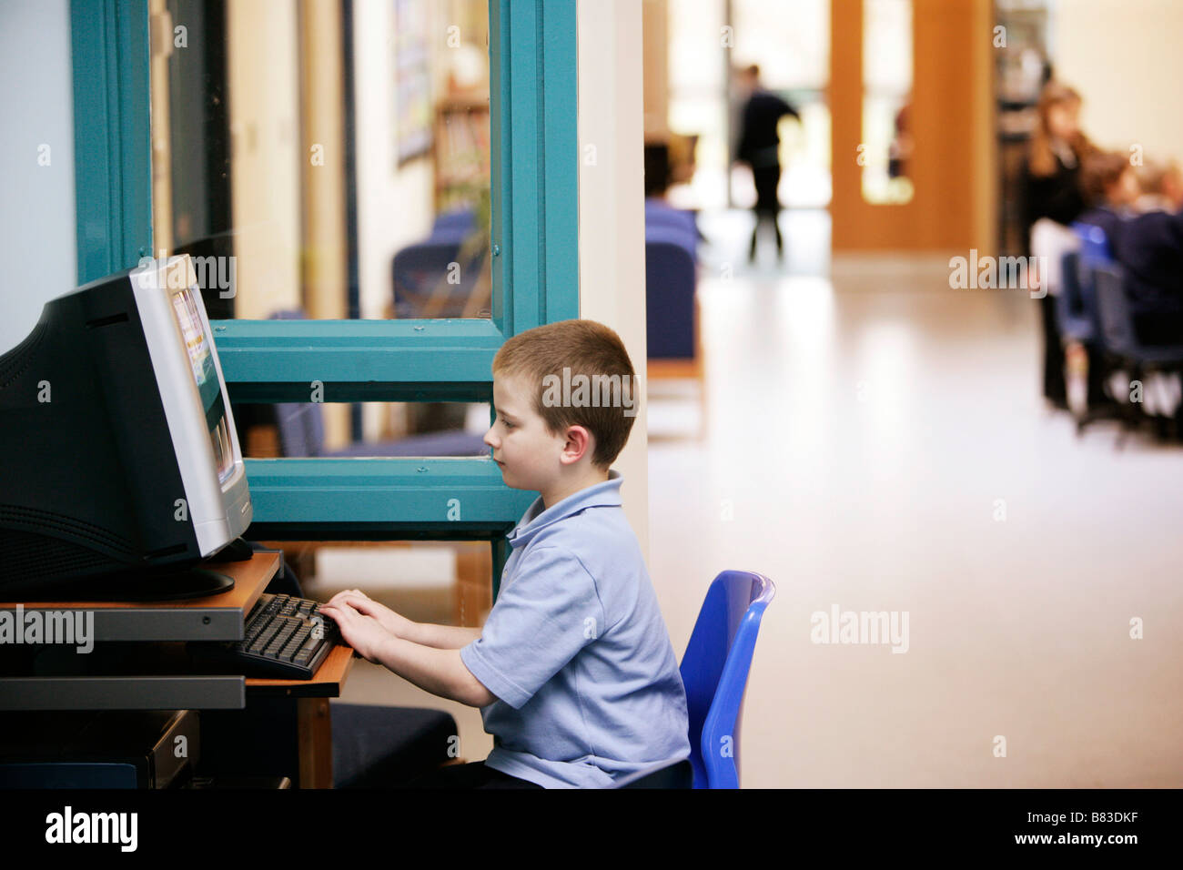primary school pupil working on computer Stock Photo - Alamy