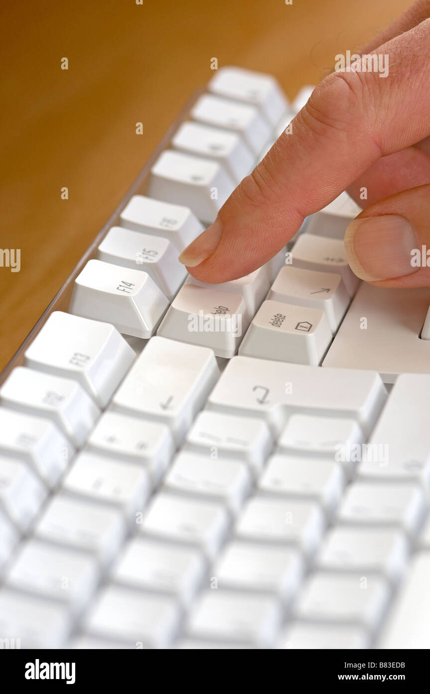 Close up of finger pointing at help key on computer keyboard Stock ...
