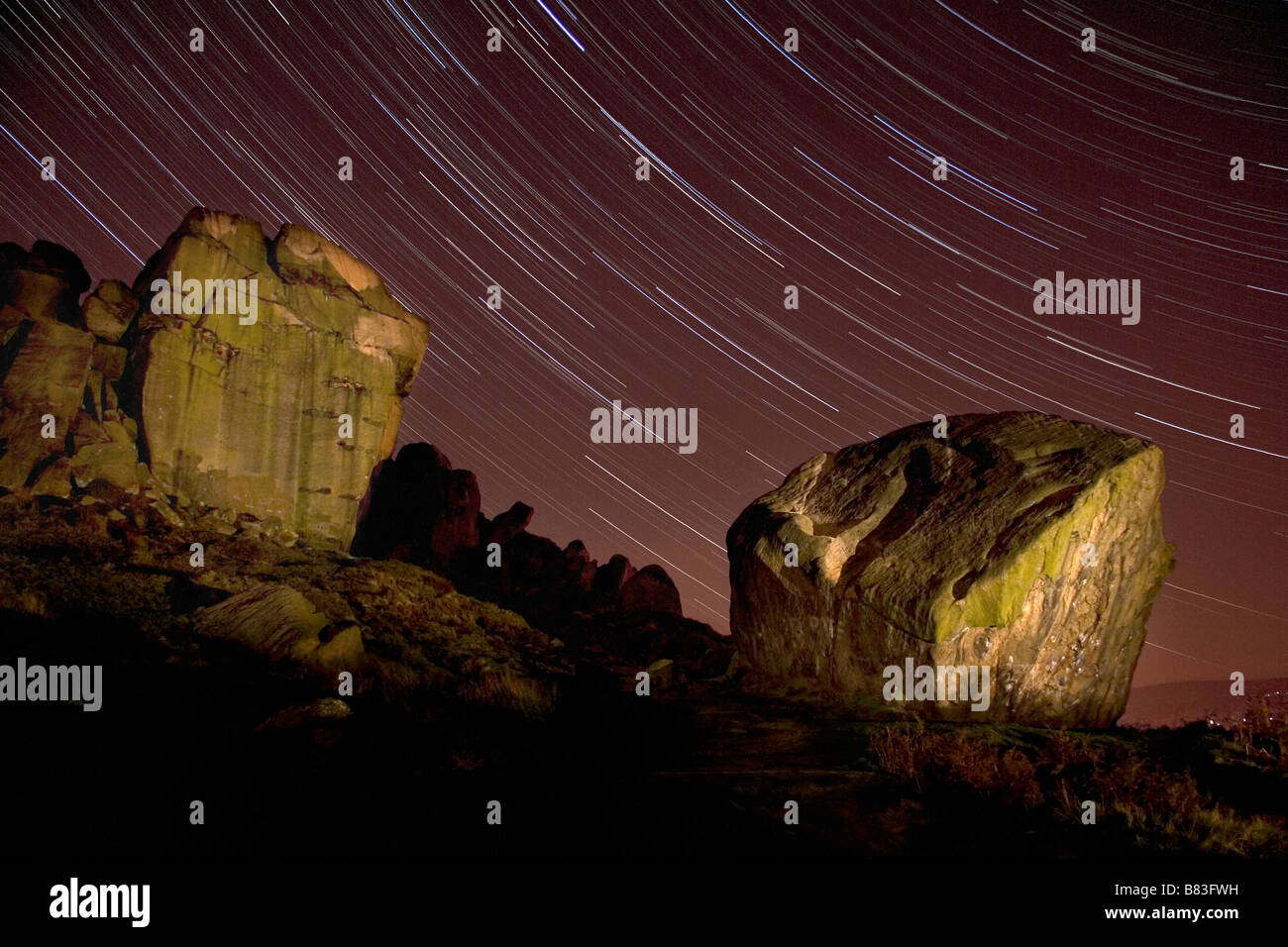 Star trails over the Cow and Calf rock formation on Ilkey Moor, West ...