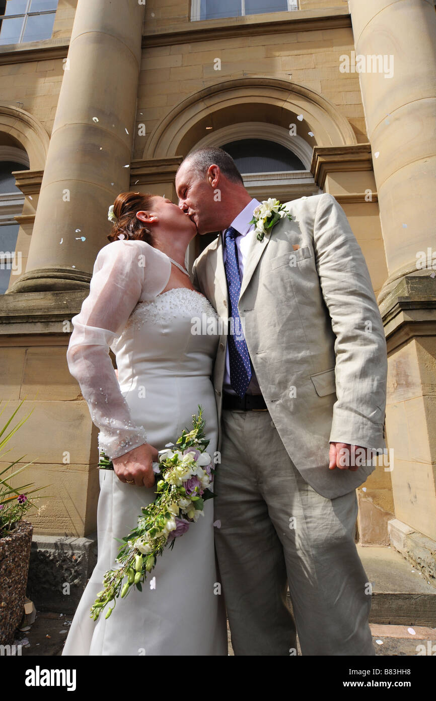Newly wed couple kissing outside a registry office, North Yorkshire ...