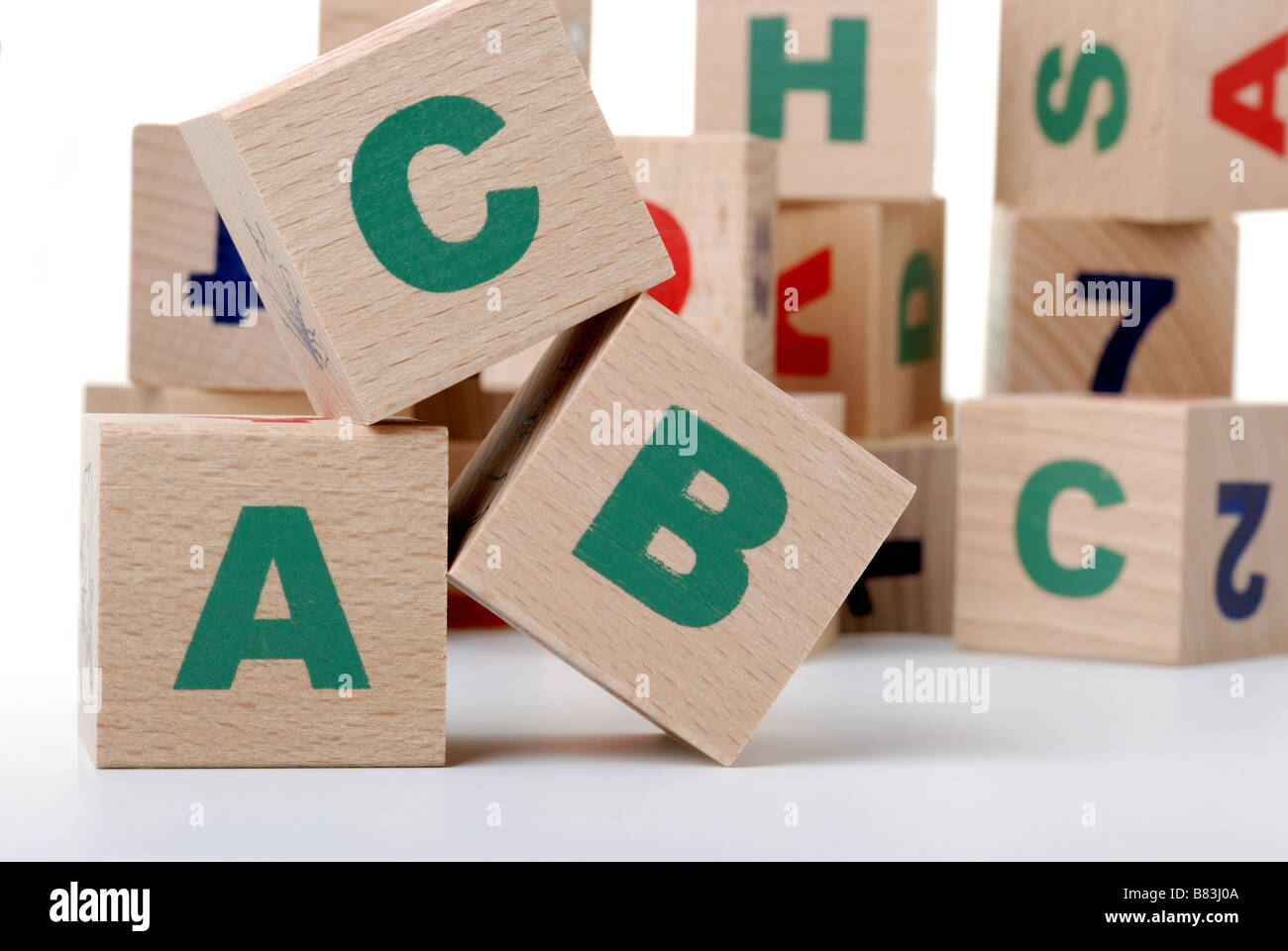 Child playing with letter blocks hi-res stock photography and images ...