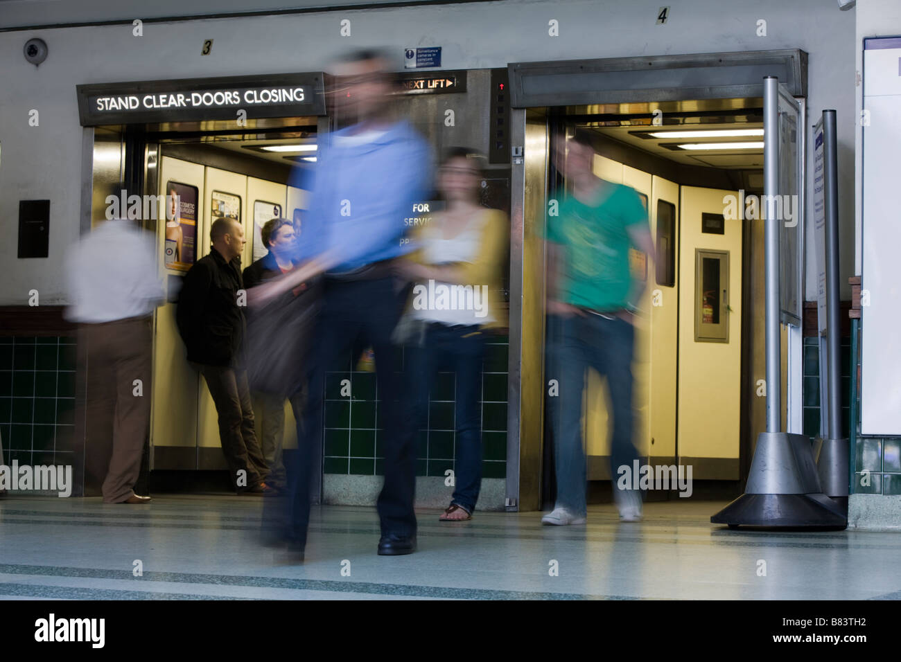 London Underground people and machines Stock Photo - Alamy