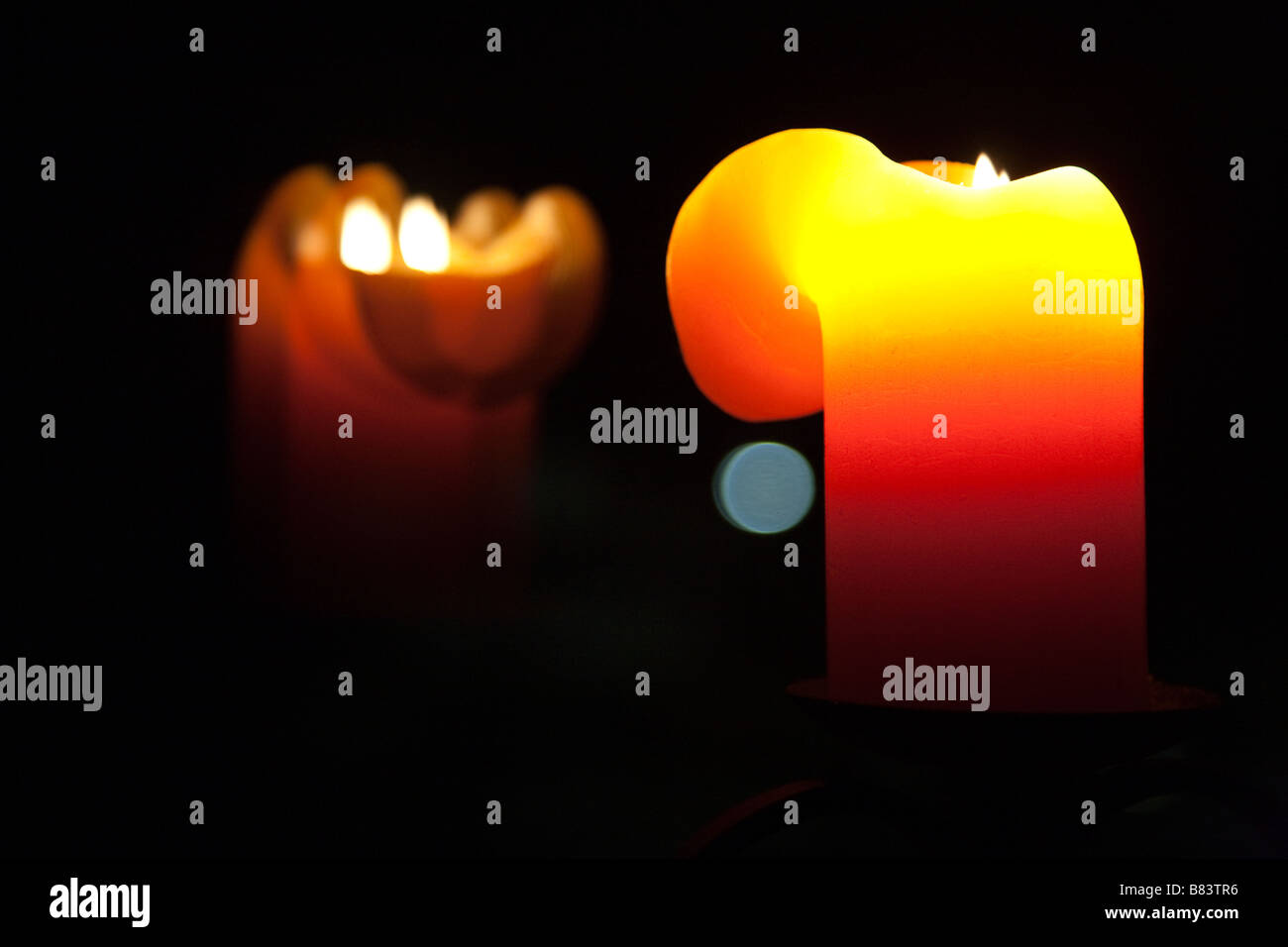 A lit candle with its reflection on a window...creating a beautiful ...