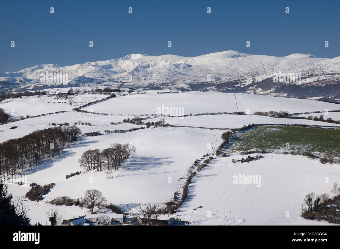 Snow covered field and mountains(UK Weather Stock Photo - Alamy