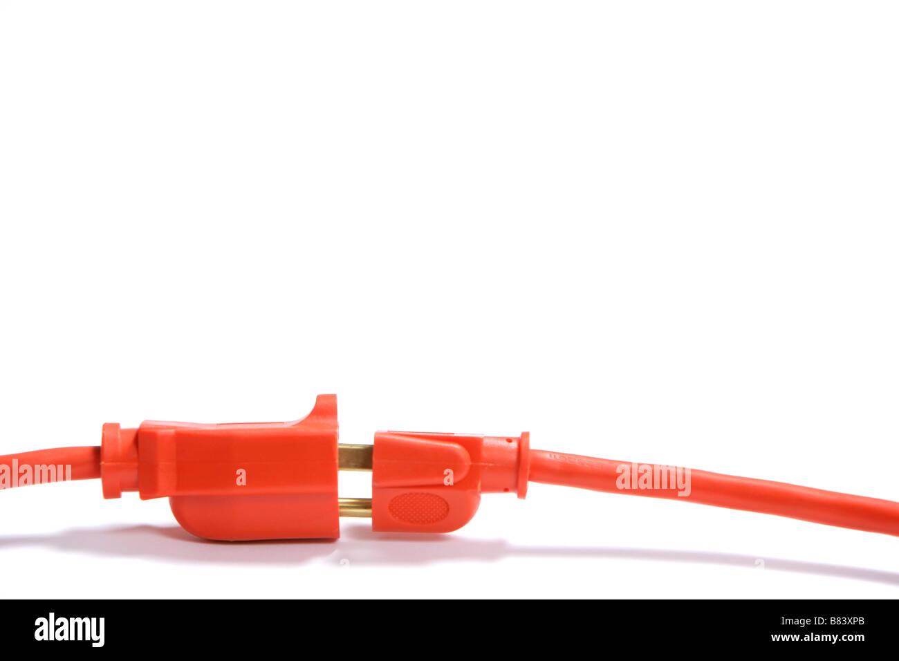 A 100 foot orange extension cord coiled up with a three way splitter ...