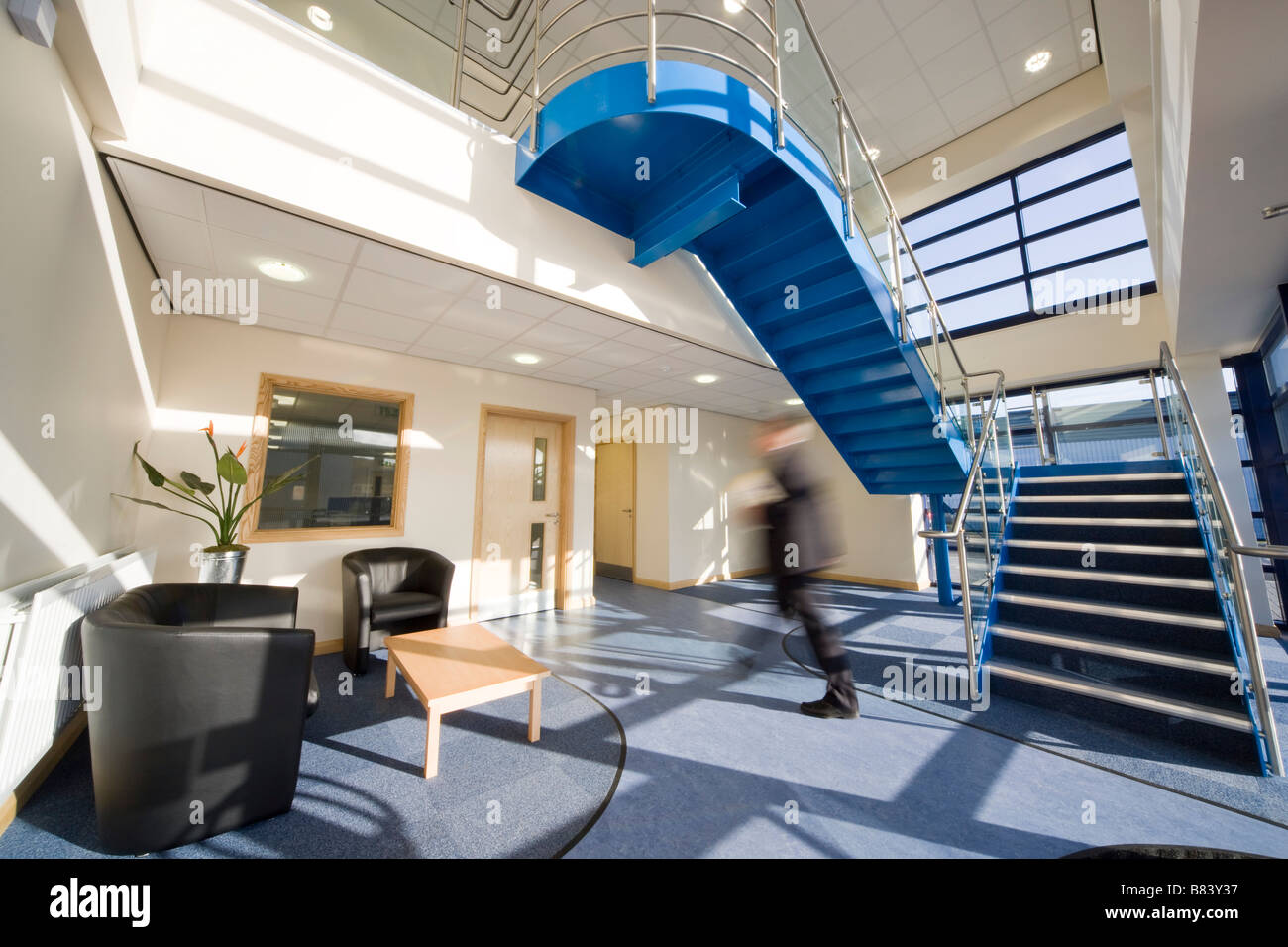Man pacing in waiting area Stock Photo - Alamy
