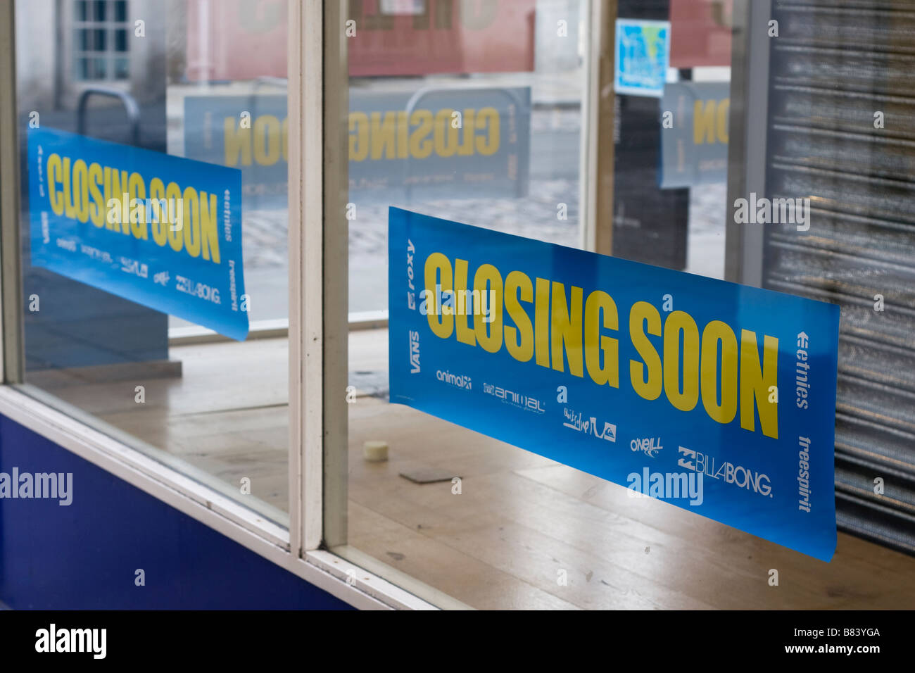 Posters in a shop window advertising the shops impending closure Stock ...