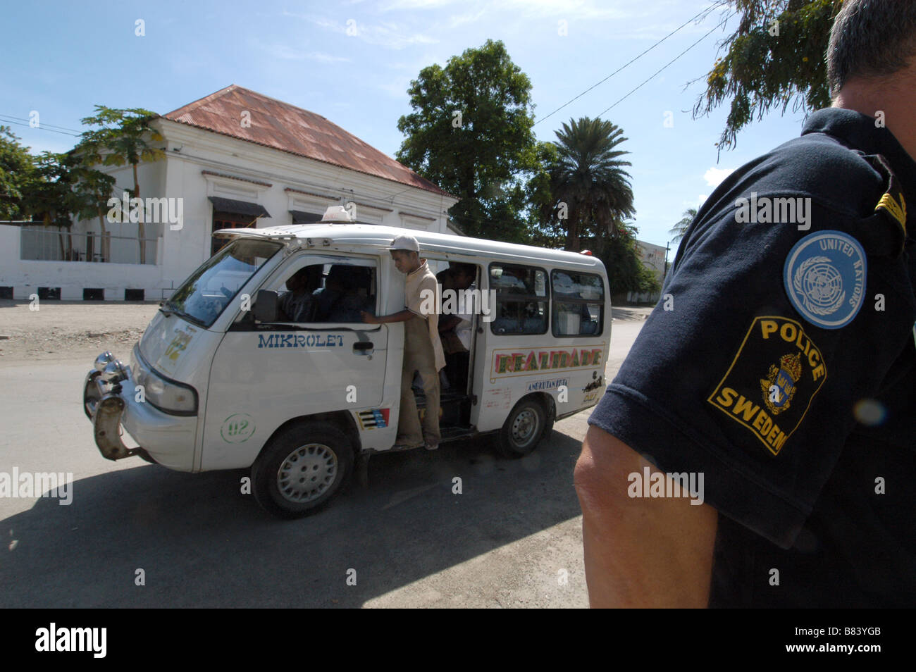 A microlet, ( minibus) in Dili East,with United Nations police right ...
