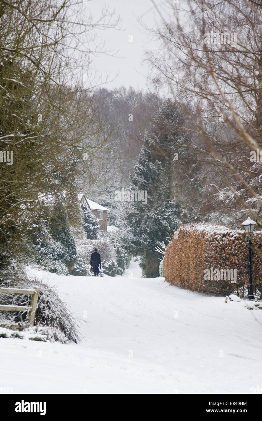 A businessman makes his way home during a heavy snow fall, Haslemere ...