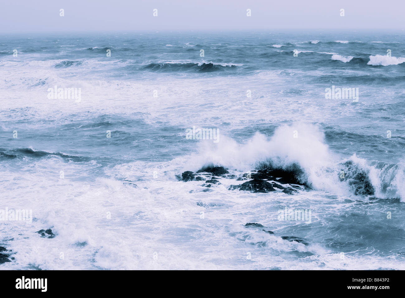 Rough sea with waves pounding shore Stock Photo - Alamy