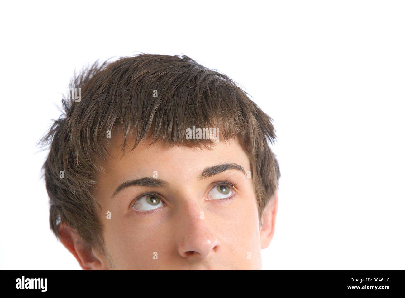 A young business man in the studio looking up Stock Photo - Alamy