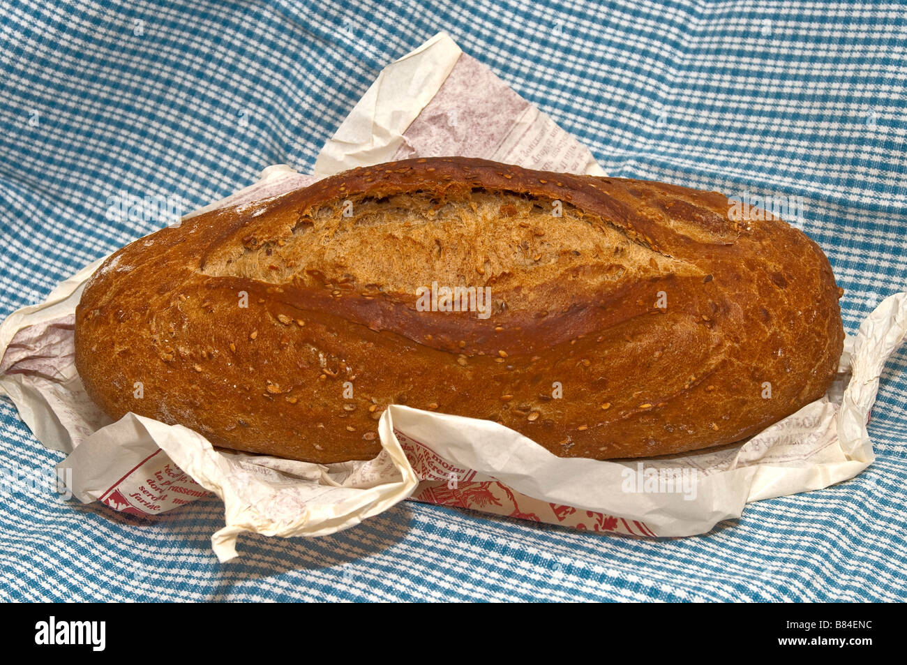 French "Pain Complet" / wholemeal loaf in paper wrapper Stock Photo - Alamy