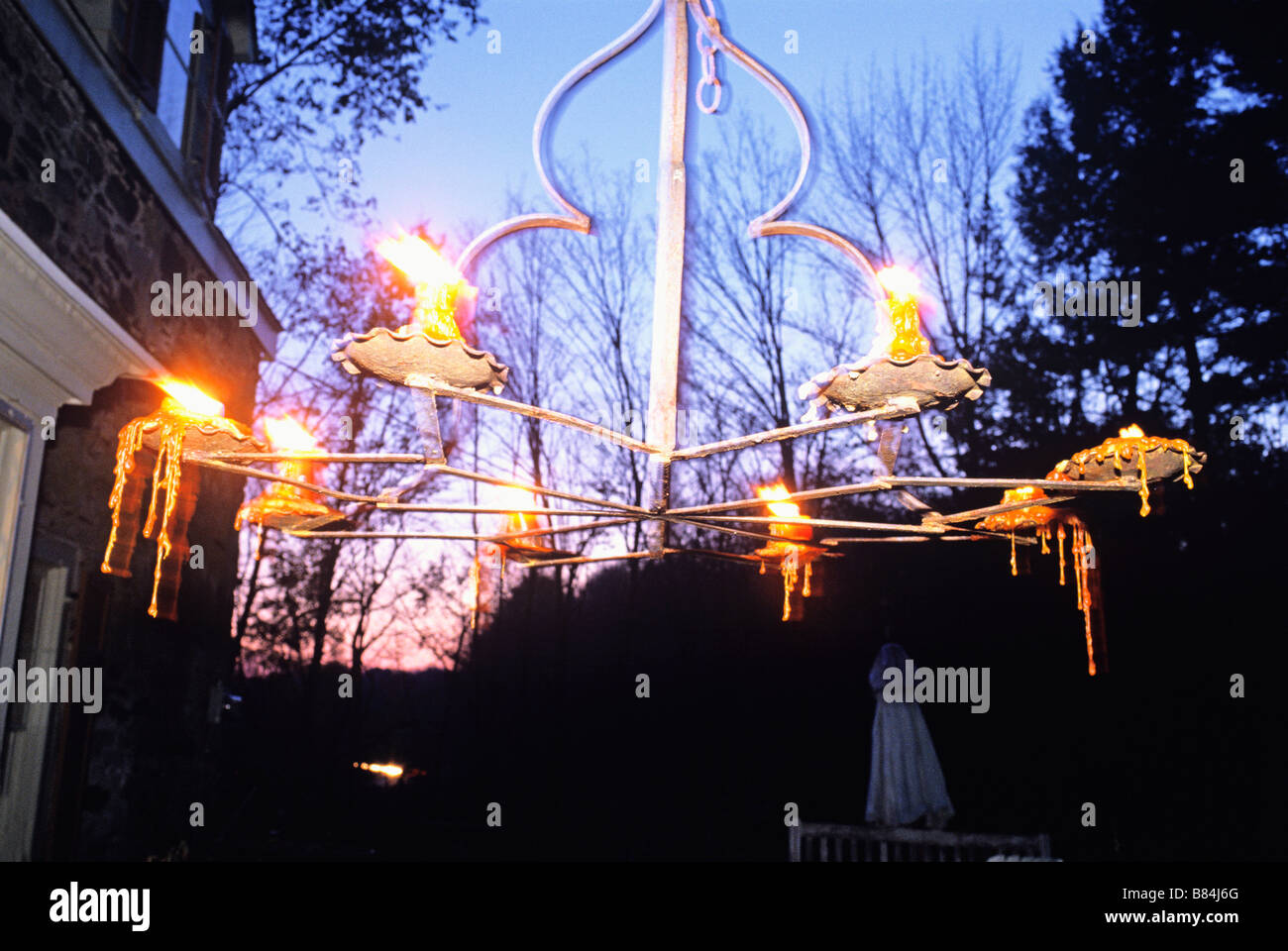 Candle chandelier, outside patio Stock Photo - Alamy