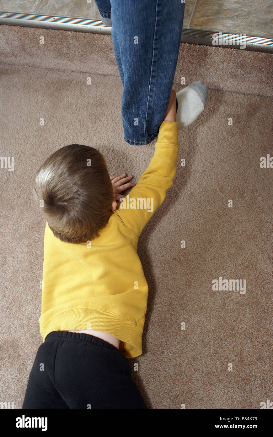 Child clinging leg hi-res stock photography and images - Alamy