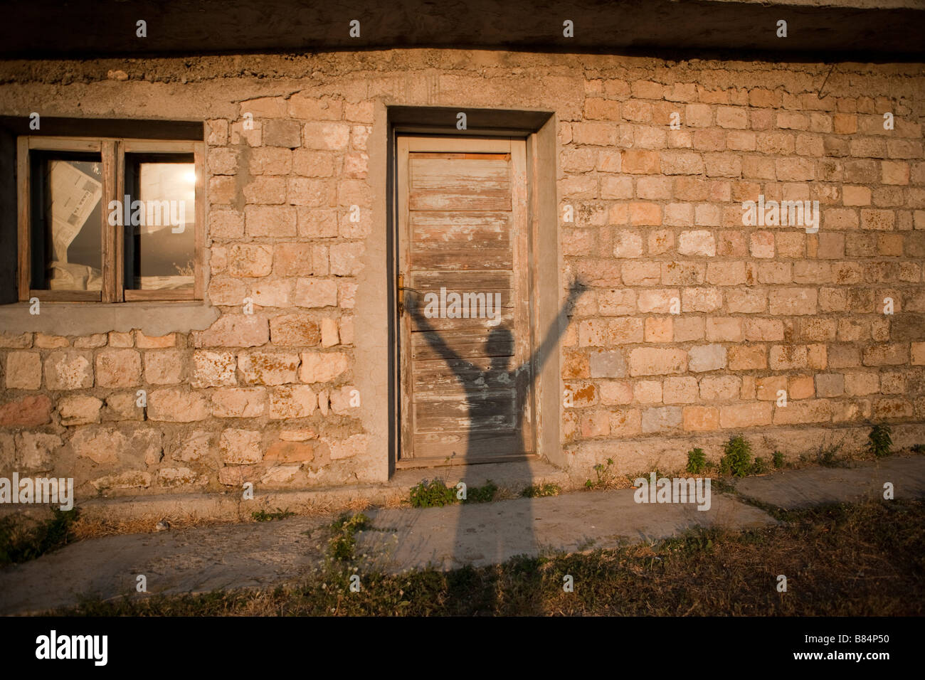 shadow playing on a poor house Stock Photo - Alamy