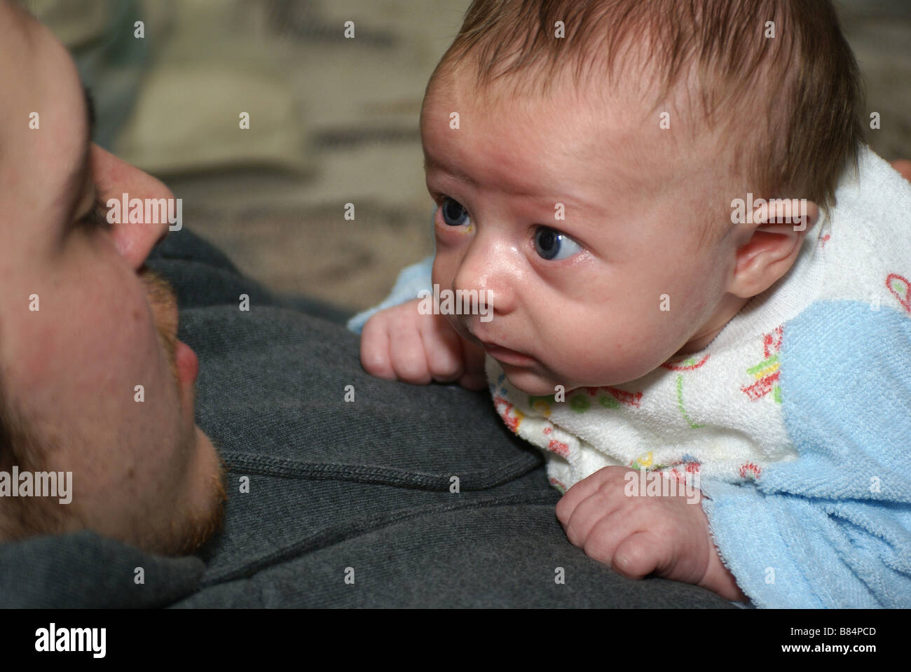 Laying on uncles stomach hi-res stock photography and images - Alamy