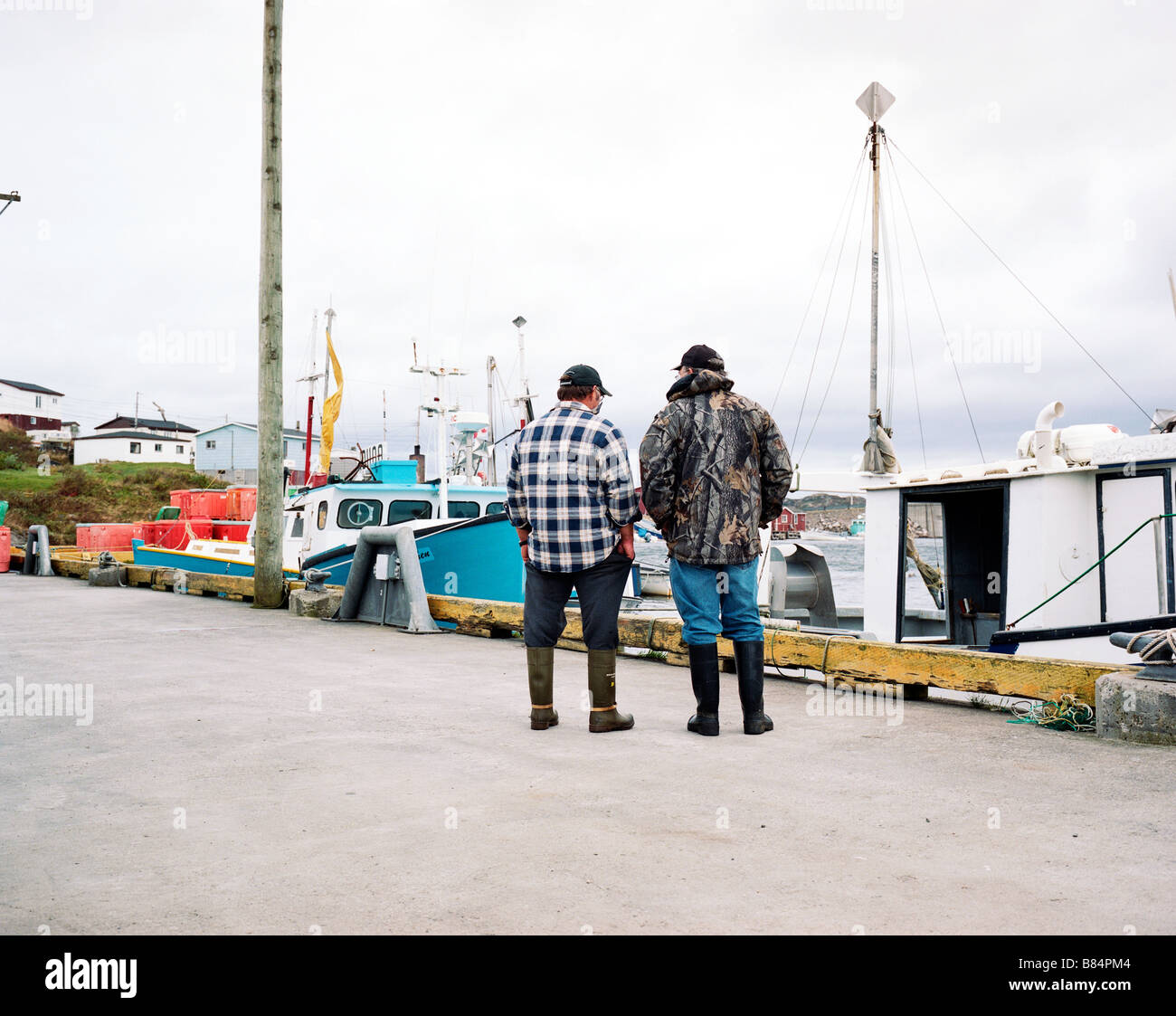 A scene from the government fish wharf in Burgeo, Newfoundland, Canada ...