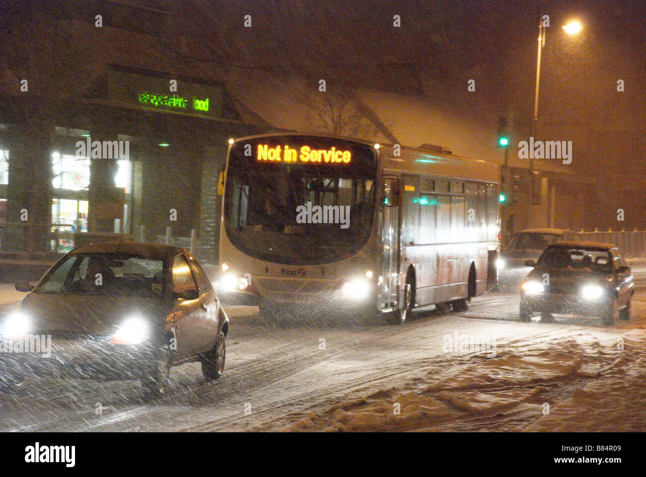 Traffic in a snow storm UK Stock Photo - Alamy
