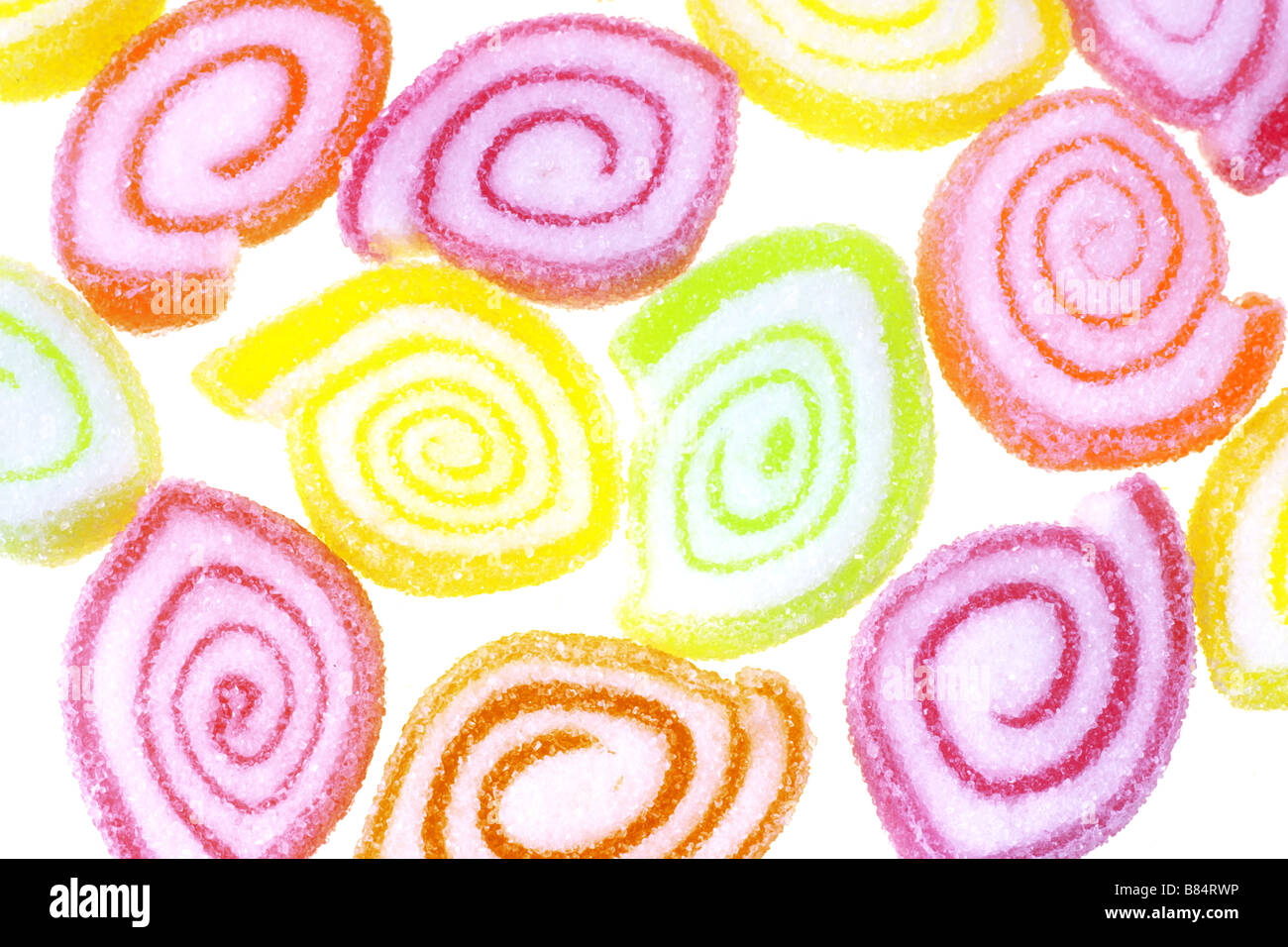 Colorful candy striped on white background Stock Photo - Alamy