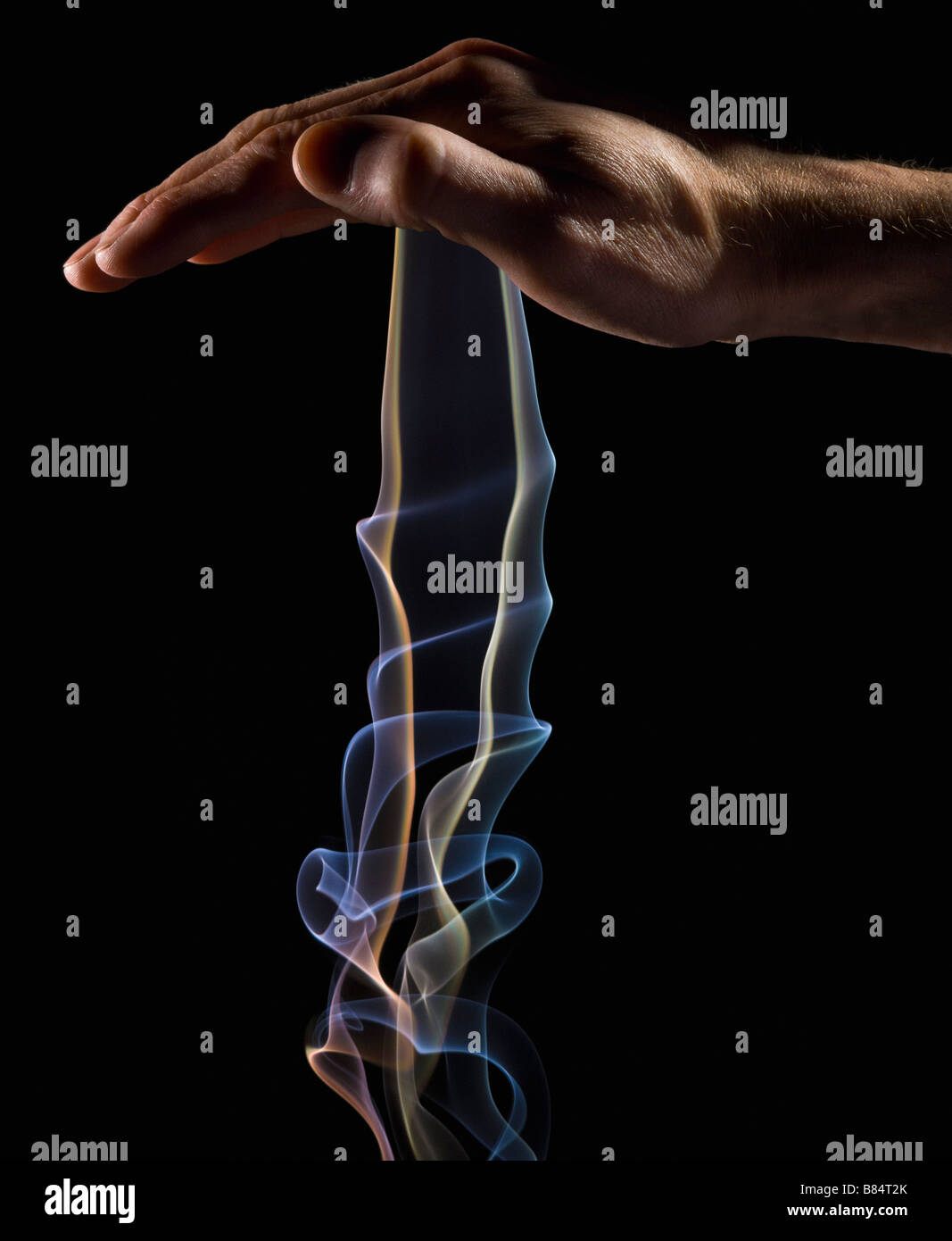 Smoke wisps from a hand Stock Photo - Alamy