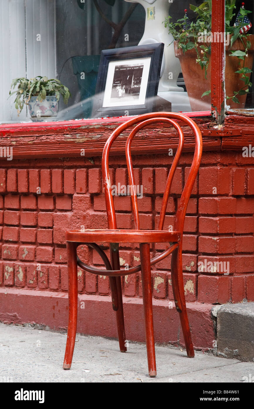 Red wooden chair outside shop in the Bowery Manhattan New York Stock ...