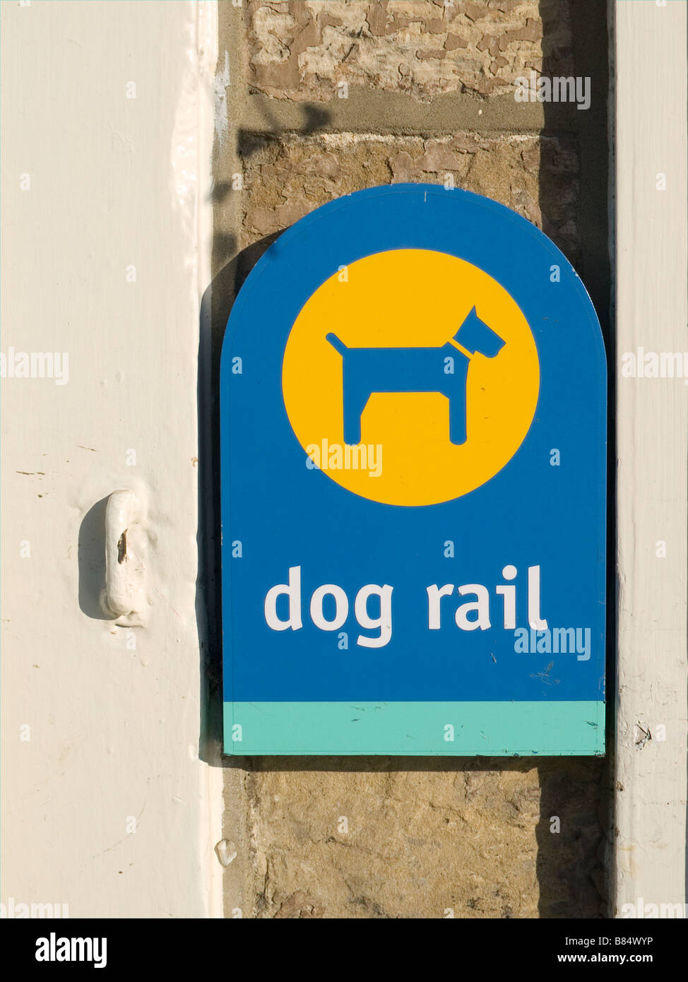 Dog rail hitching point to secure a dog outside a shop Stock Photo - Alamy