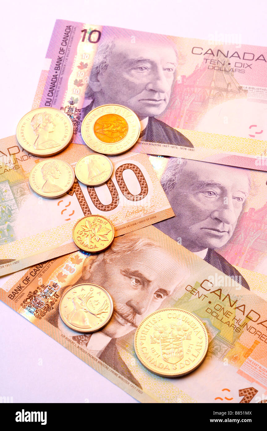Canadian paper currency and coins Stock Photo - Alamy
