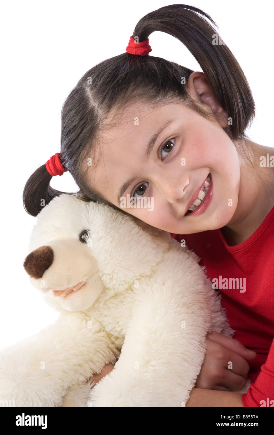 Little girl is hugging big teddy bear Stock Photo - Alamy