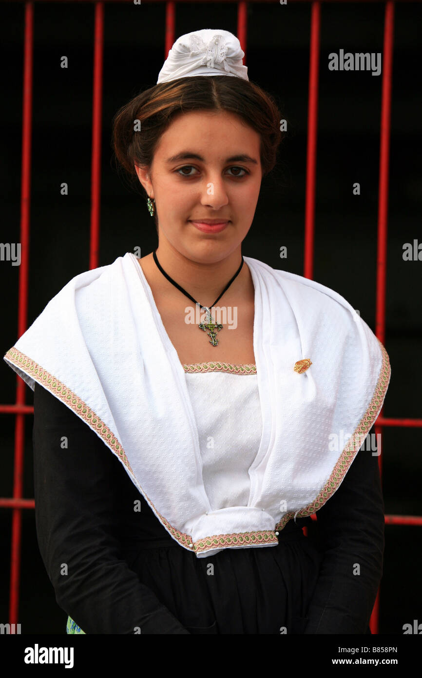 Young girl in traditional dress of the French Provence in Saintes ...