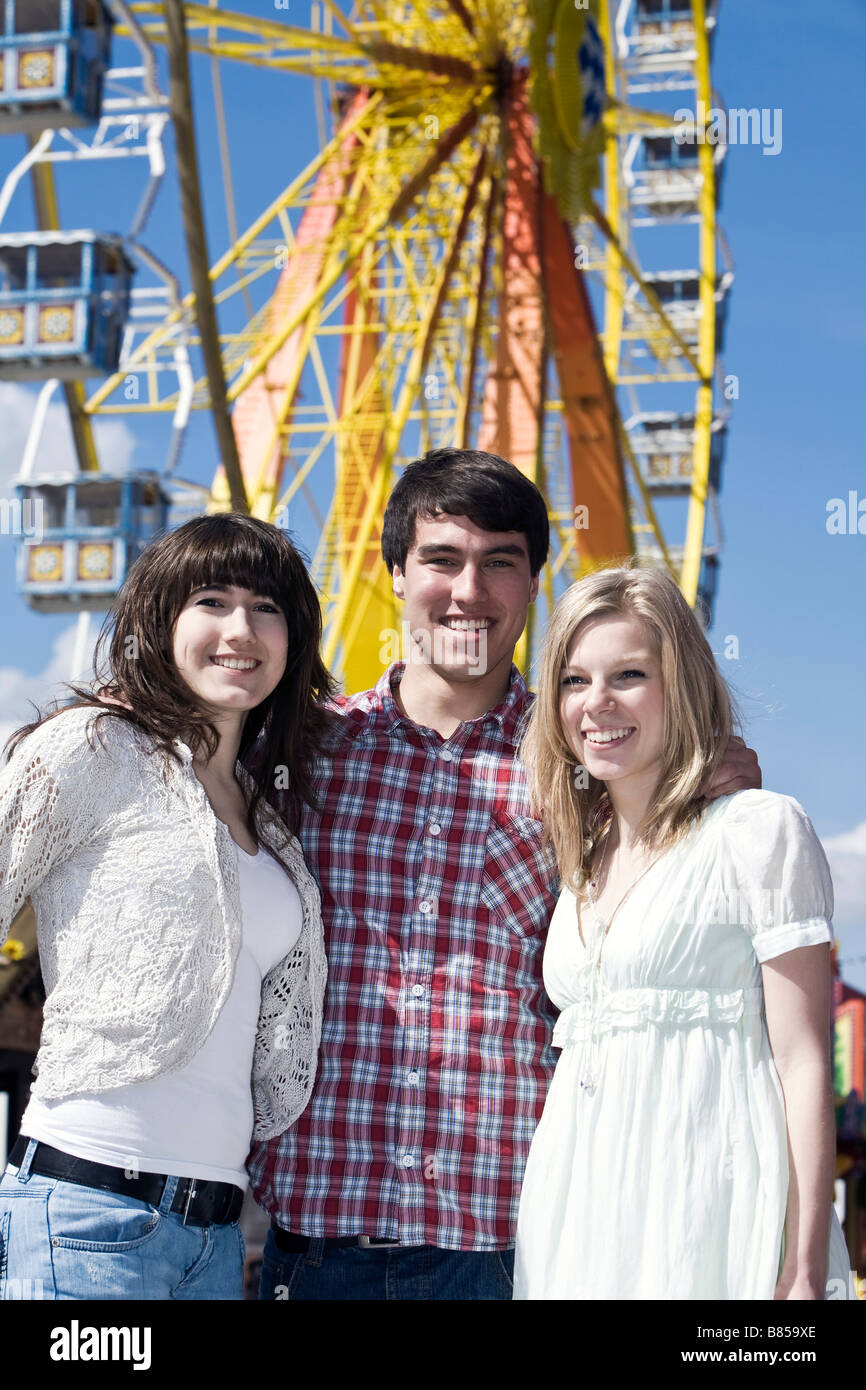 portrait of three teenagers on fun fair Stock Photo - Alamy
