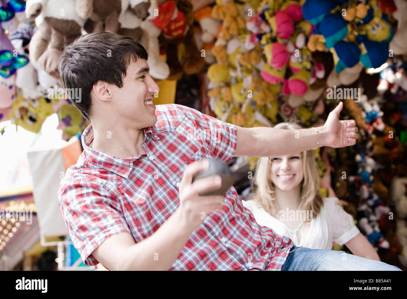 Throwing ball at cans hi-res stock photography and images - Alamy