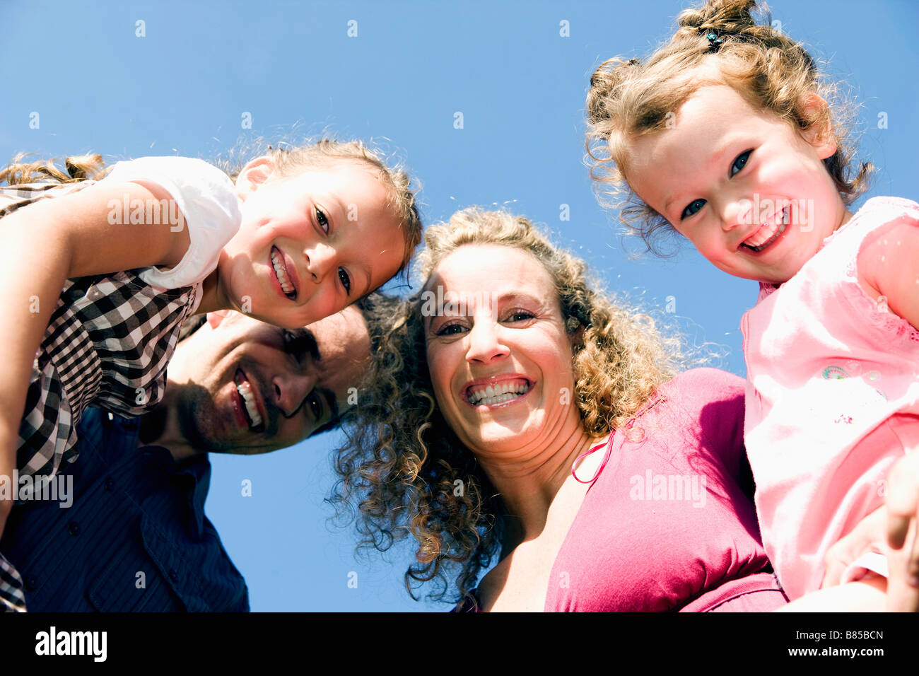 low angle portrait of family with two children Stock Photo - Alamy