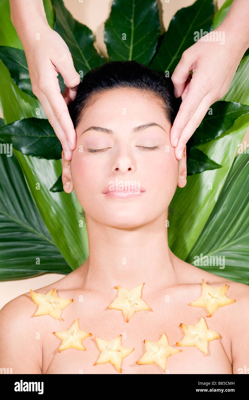 headshot of young woman being massaged Stock Photo - Alamy