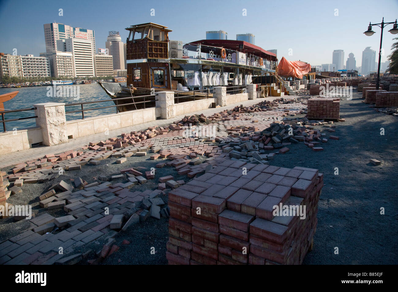 Dubai creek refurbishment of pavement bricks uae Stock Photo - Alamy