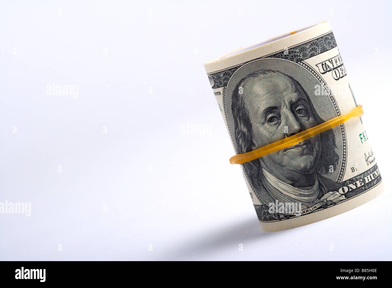 Rolled up dollar notes hi-res stock photography and images - Alamy