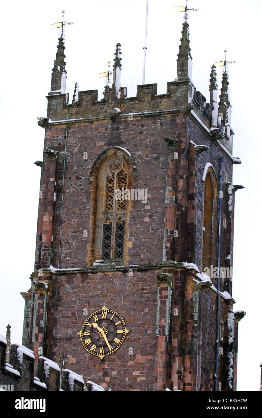 Winter snow hits Tiverton in Devon The Bell Tower of St Peters Church ...