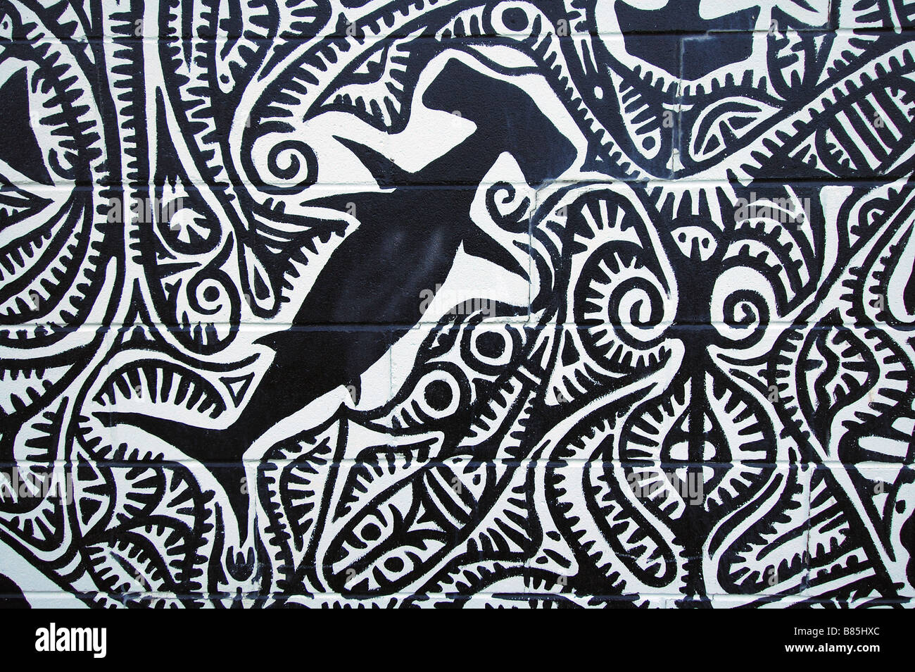 Hammerhead shark rendered in traditional style on public brick wall ...
