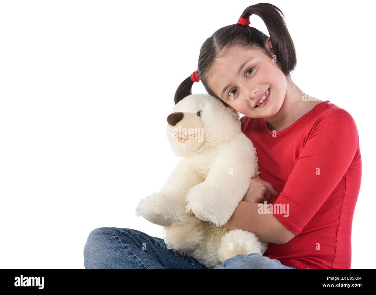 Little girl is hugging big teddy bear Stock Photo - Alamy