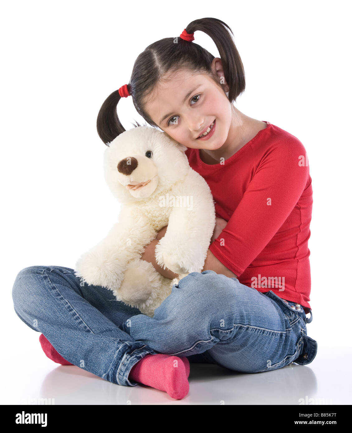 Little girl is hugging big teddy bear Stock Photo - Alamy