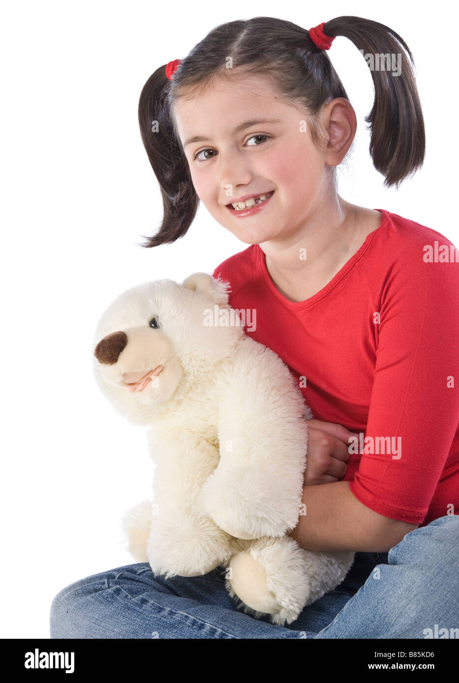 Little girl is hugging big teddy bear Stock Photo - Alamy