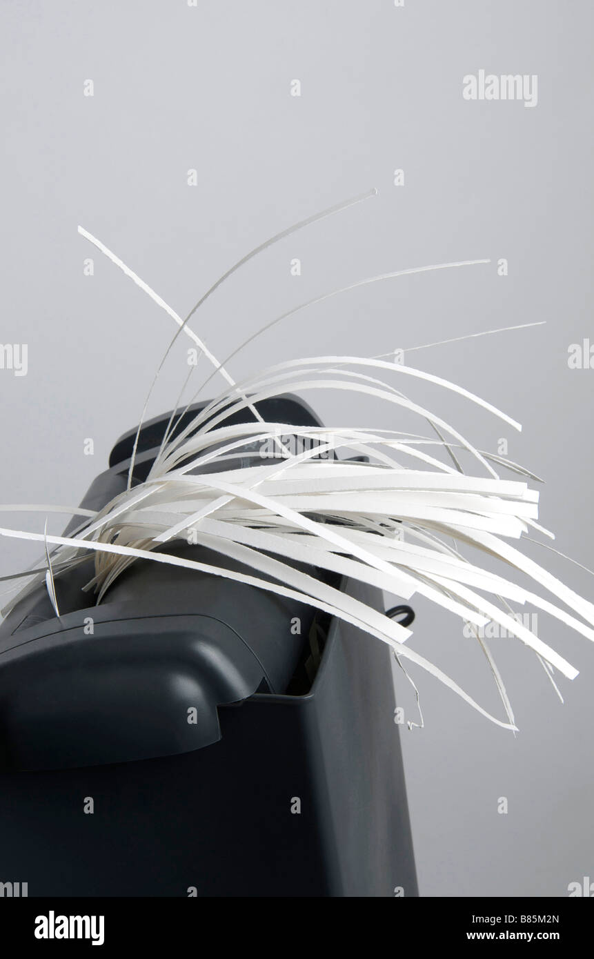 Frayed wires protruding from the top of a black electronic device ...