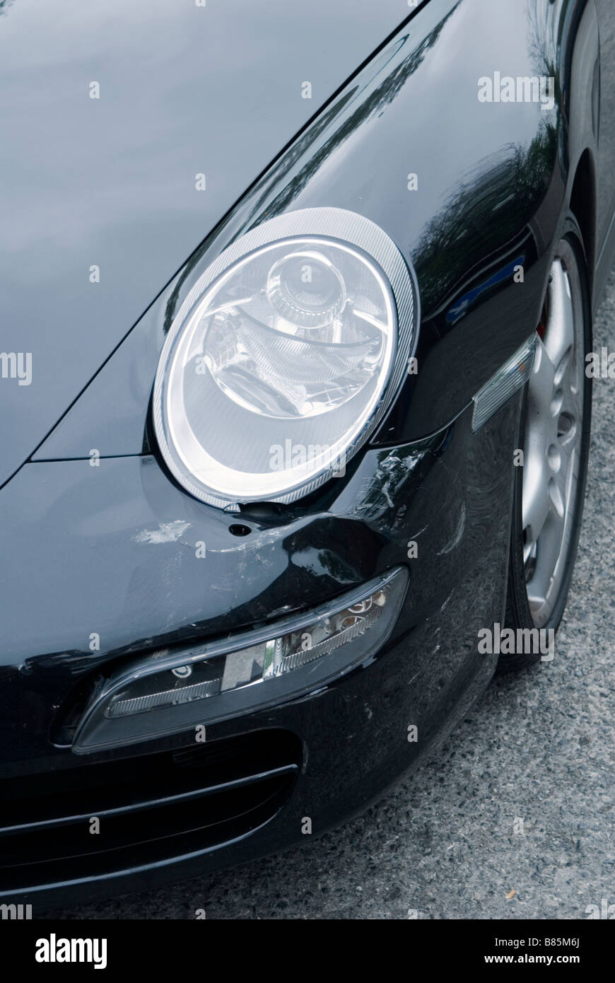 Damage caused by an accident on the front of a porsche sports car Stock ...