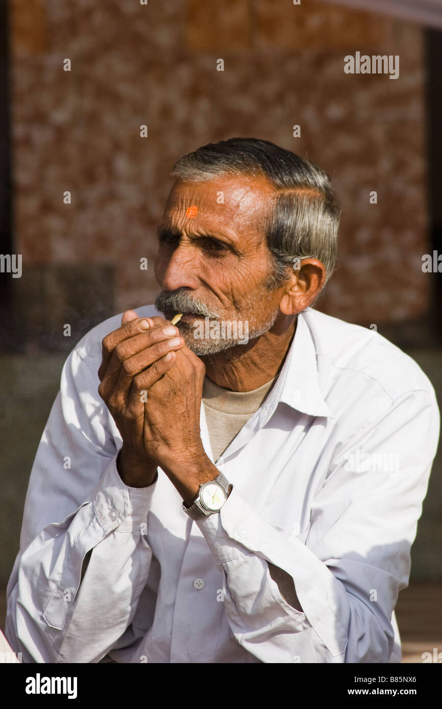 Indian man smoking cigarette hi-res stock photography and images - Alamy