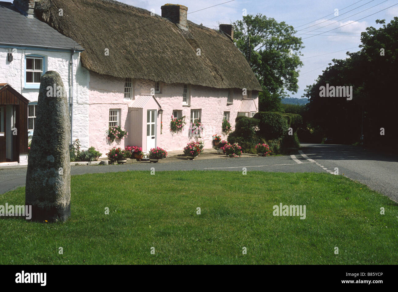 Standing stone in village centre, Mawgan-in-Meneage, Cornwall Stock ...