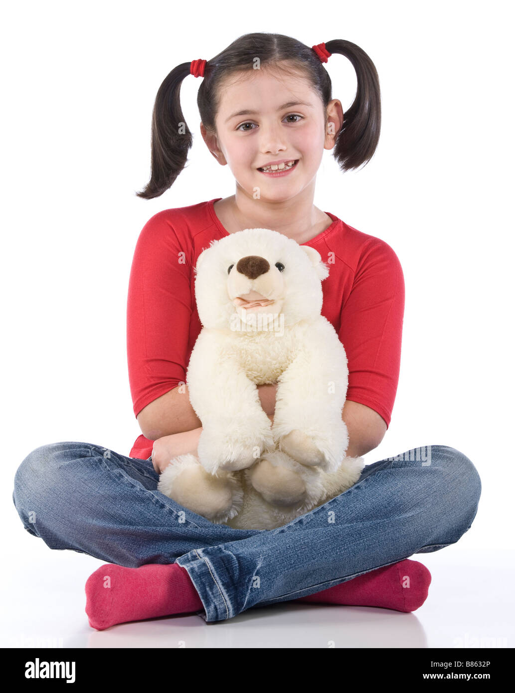 Little girl is hugging big teddy bear Stock Photo - Alamy