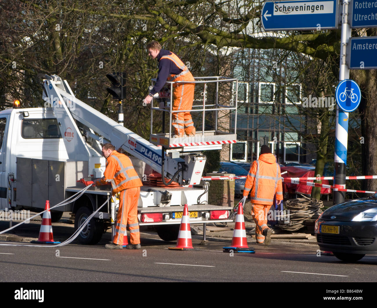 Road construction crew working on traffic lights, The Hague ...